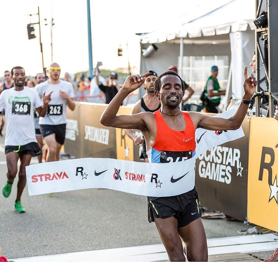 Fikadu Girma Teferi crossing the line in 14:36, just ahead of second ...